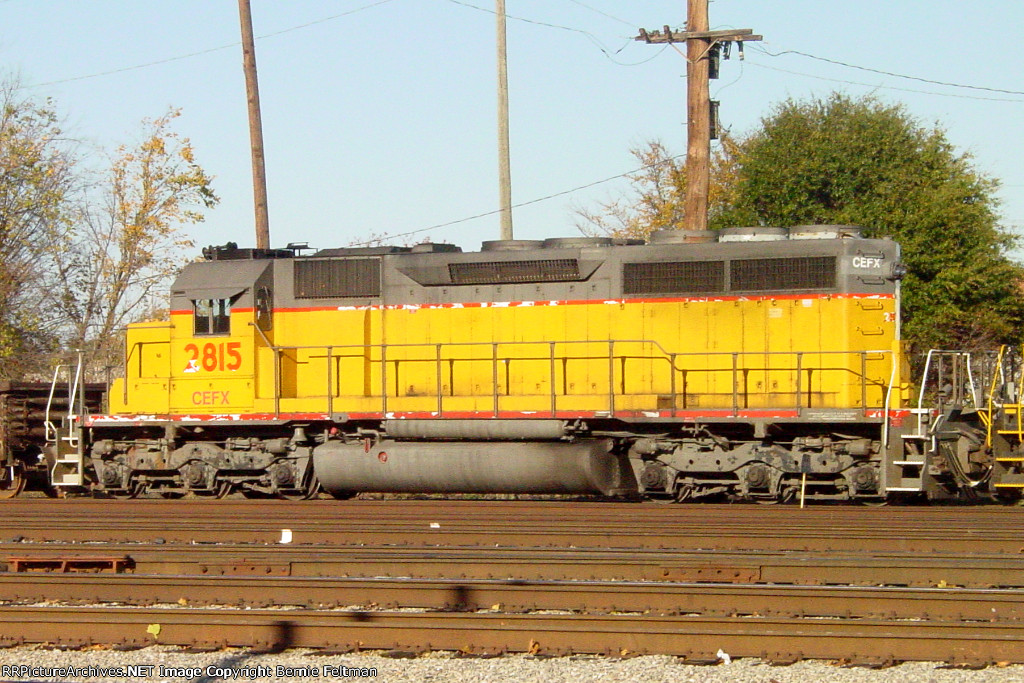 Long-hood view of CEFX SD40-2 #2815 working the east end of the yard